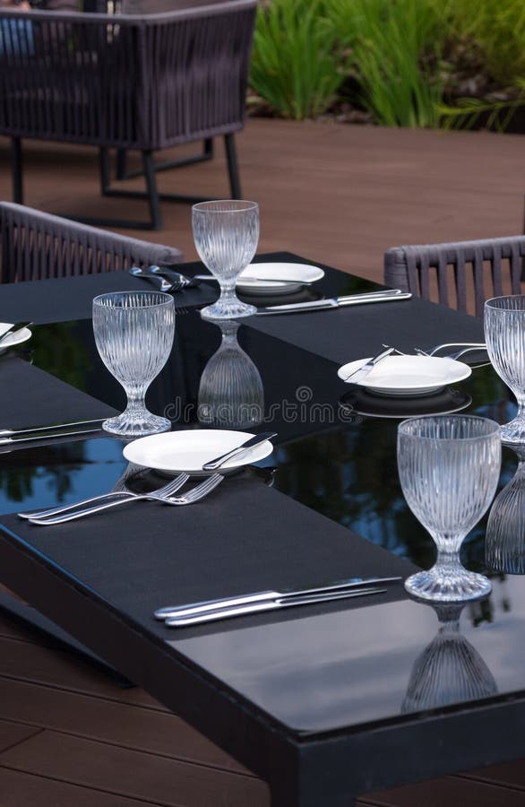 Crystal Empty Glasses, White Plates and Cutlery on a Table in a Beach ...