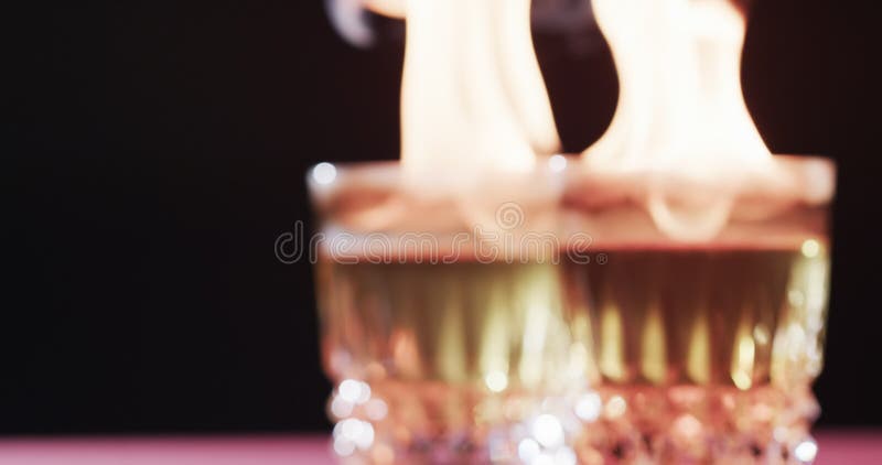 A Crystal Glass with a Flammable Liquid on Fire, Creating a Dramatic ...