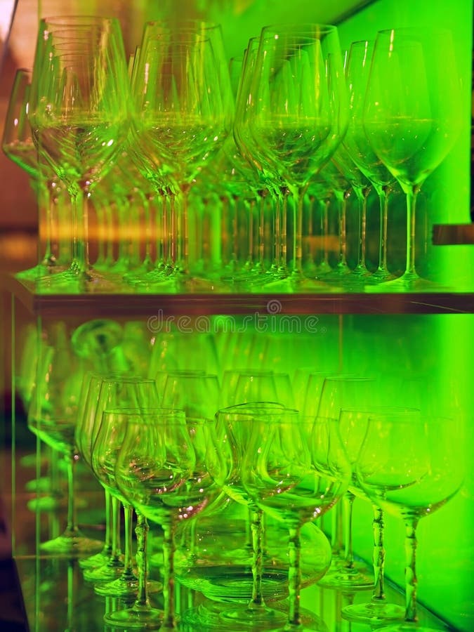 Crystal Glasses Lined Up in Illuminated Plexiglass Case Stock Image ...