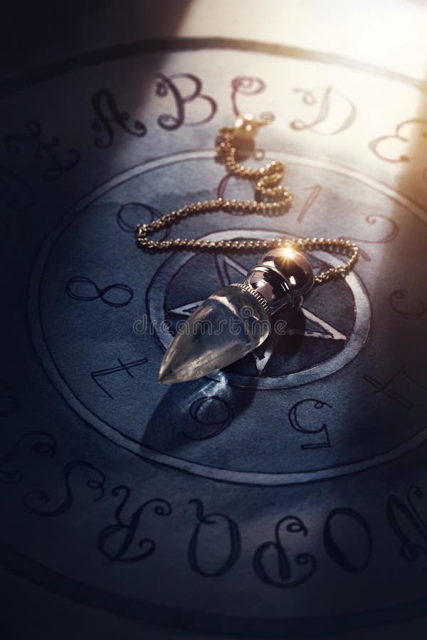 Crystal Pendulum on a Board Stock Image - Image of paranormal ...