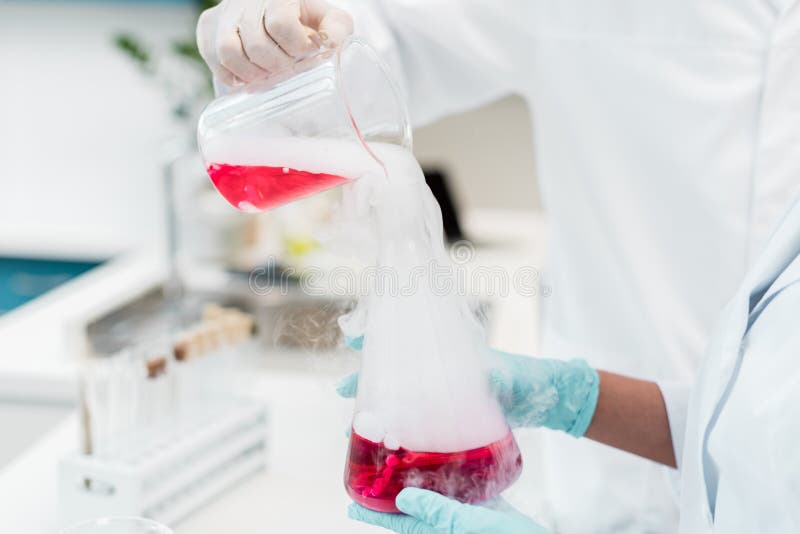 Cscientists Making Experiment with Reagent and Flasks Stock Image ...