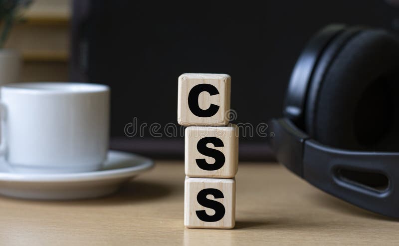 CSS -word on Cubes on the Background of the Tablet, Headphones and a ...
