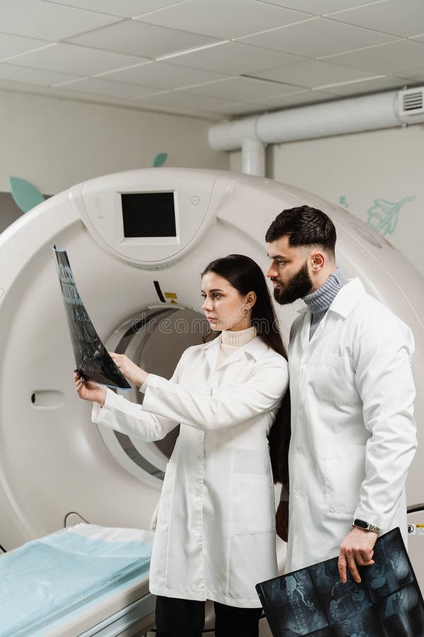 CT Scan Doctors are Discussing X-ray of Computed Tomography of Brains ...
