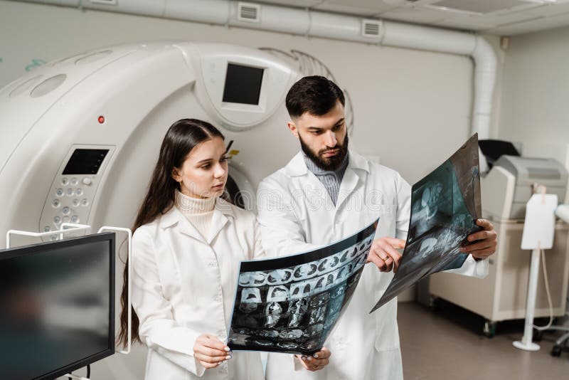 CT Scan Doctors are Discussing X-ray of Computed Tomography of Brains ...