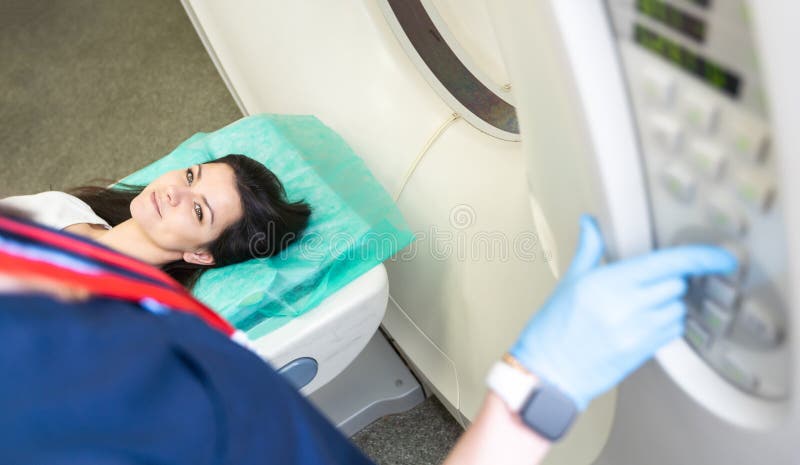 CT Scan Technologist Overlooking Patient in Computed Tomography Scanner ...
