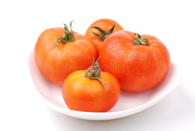 Cuatro Tomates En Una Placa Foto de archivo - Imagen de planta, cocina ...