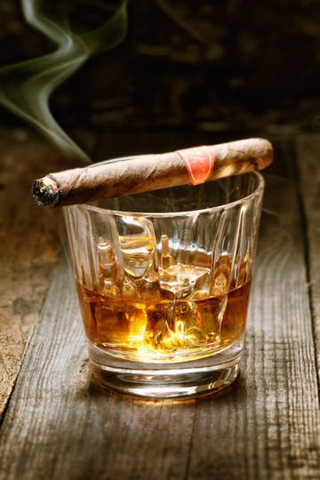 Cuban cigar on whisky stock image. Image of habit, shot - 26562003