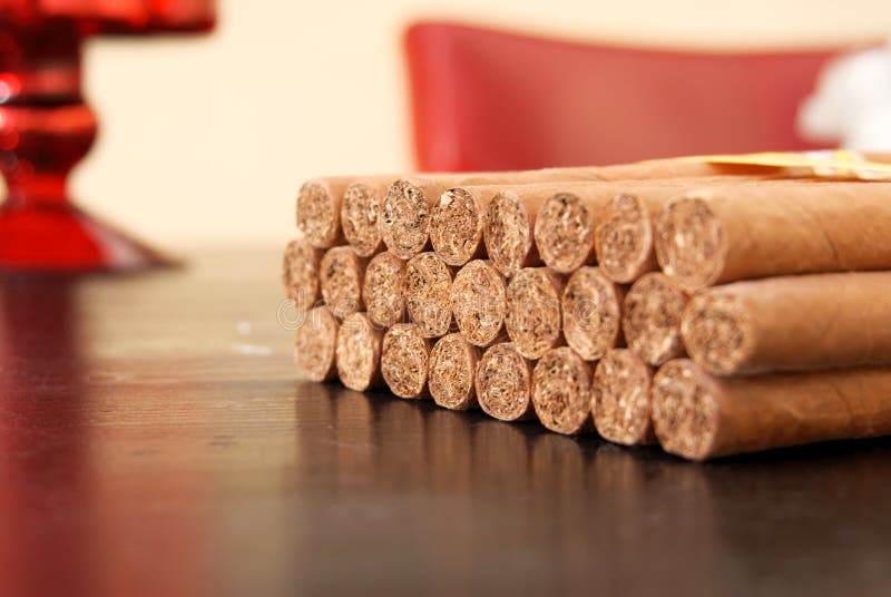 Cuban cigars on the table stock photo. Image of close - 52985458