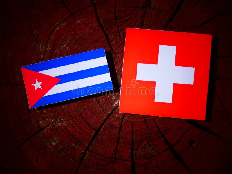 Cuban Flag with Swiss Flag on a Tree Stump Stock Photo - Image of ...