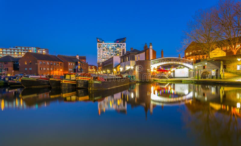 The Cube Behind Brick Buildings Alongside a Water Channel in the ...