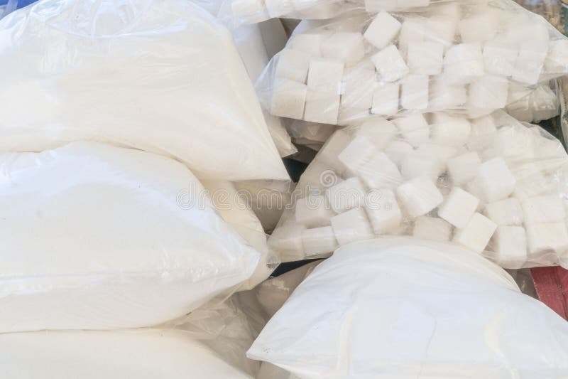Cube and Granulated Sugar in Transparent Bags at Market Stock Photo ...