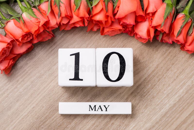 Cube Shape Calendar for MAY 10 on Wooden Table with Roses Stock Photo ...