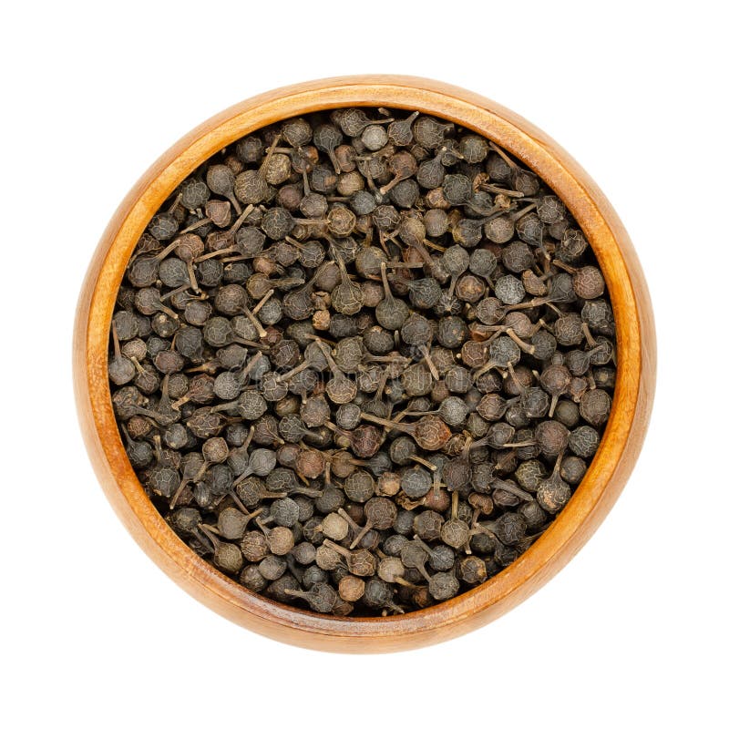 Cubeb Berries, Tailed Pepper or Java Pepper, in a Wooden Bowl Stock ...