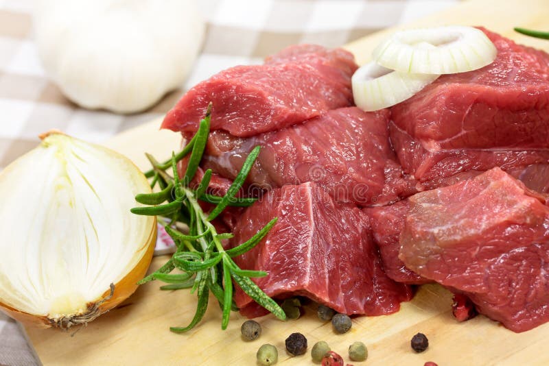 Raw Cubed Beef in Cast Iron Skillet on Table Stock Photo - Image of ...