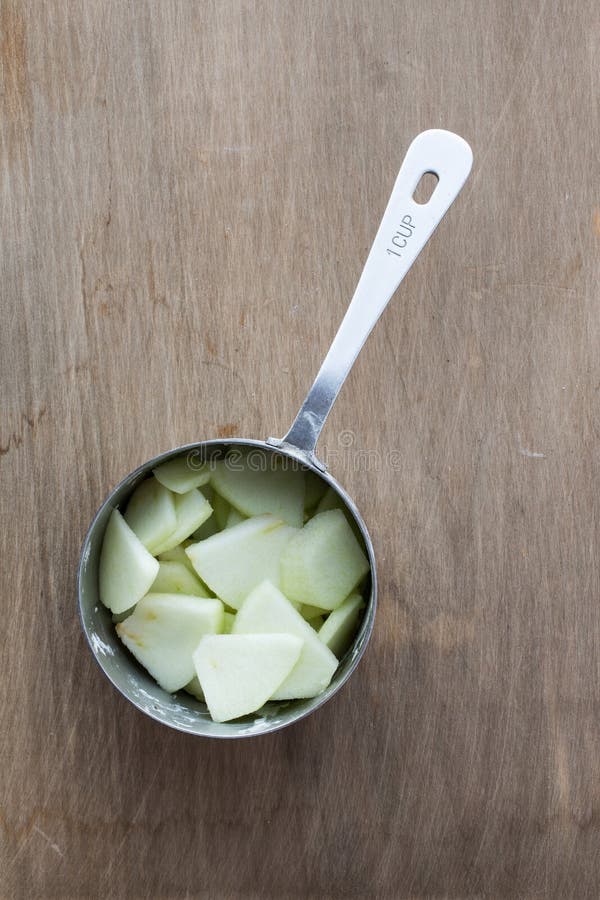 Cubes of Apple in a Measuring Cup Stock Photo - Image of bake ...