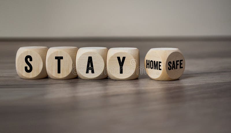 Cubes and Dice with Words Stay Home and Stay Safe on Wooden Background ...