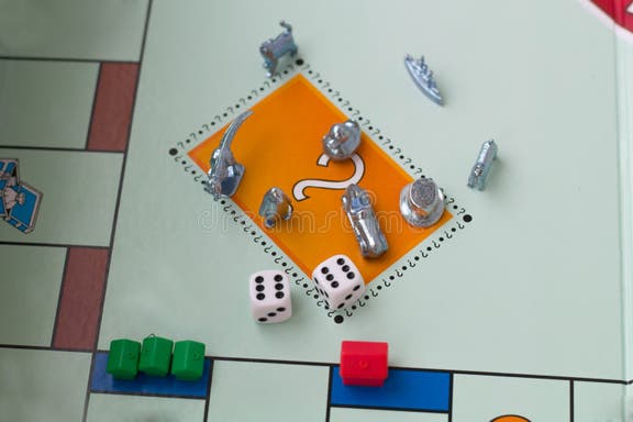 Cubes with the Game Monopoly on the Table Editorial Photo - Image of ...