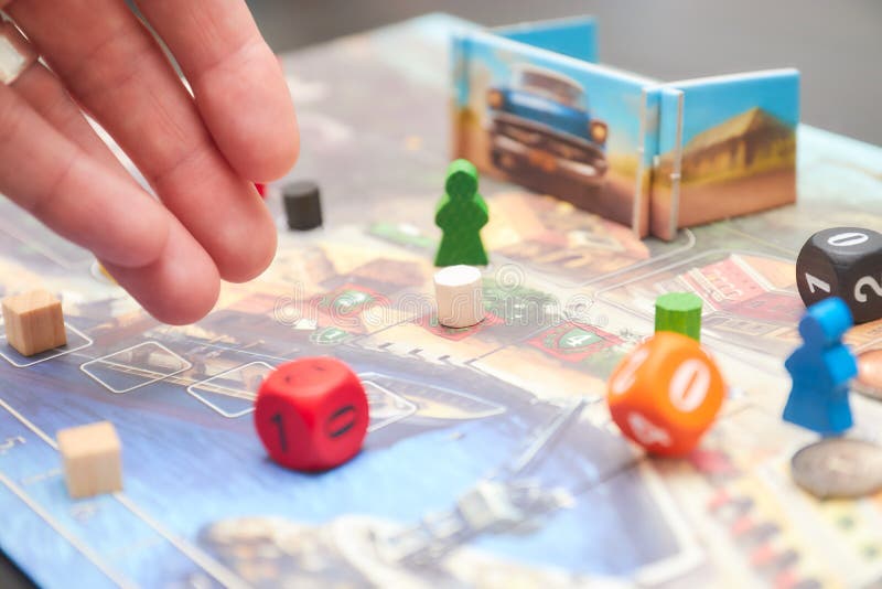 Cubes with the Game on the Table. Themed Board Games. Vertical View of ...