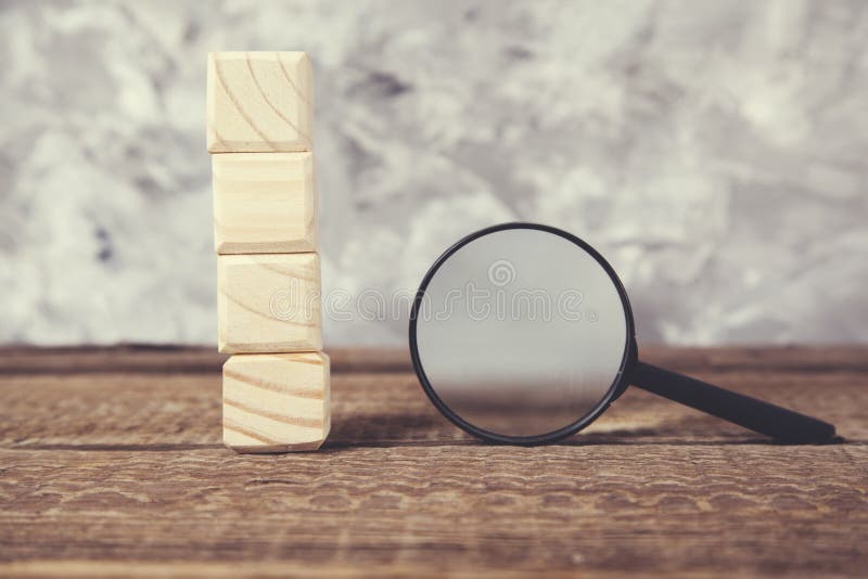 Cubes with magnifier stock image. Image of concept, wooden - 141997297