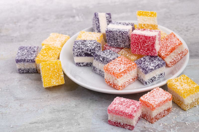 Cubes of Multi-colored Marmalade in Powdered Sugar on Plate. the ...