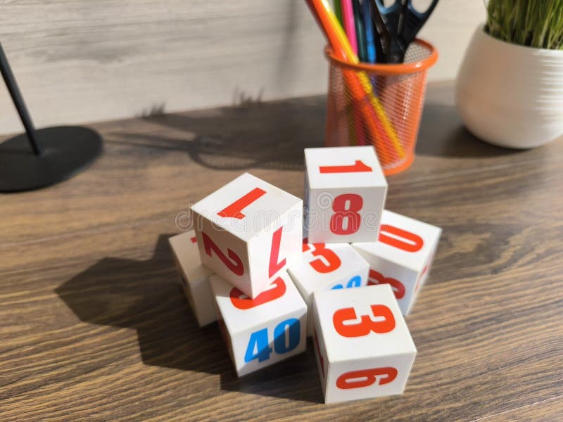Cubes with Numbers on a Wooden Table Stock Image - Image of cube, date ...