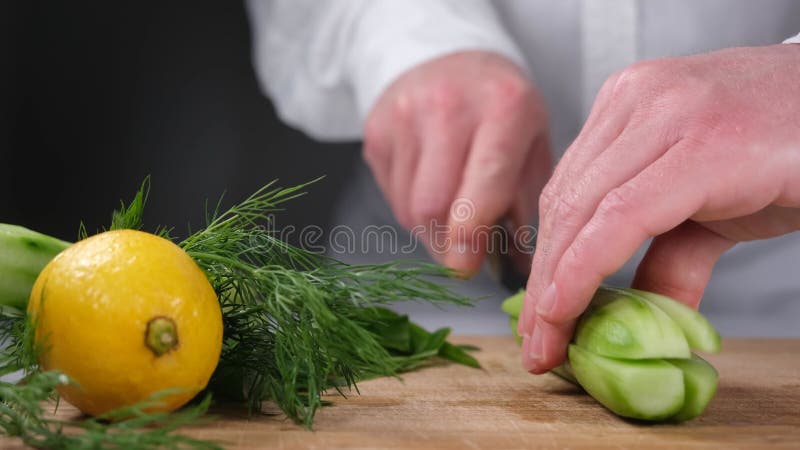 Chef cutting cucumber stock footage. Video of board - 253372990