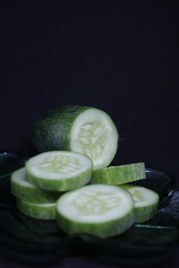 Cucumber Chunks Seven Potrait on a Background Black Stock Image - Image ...