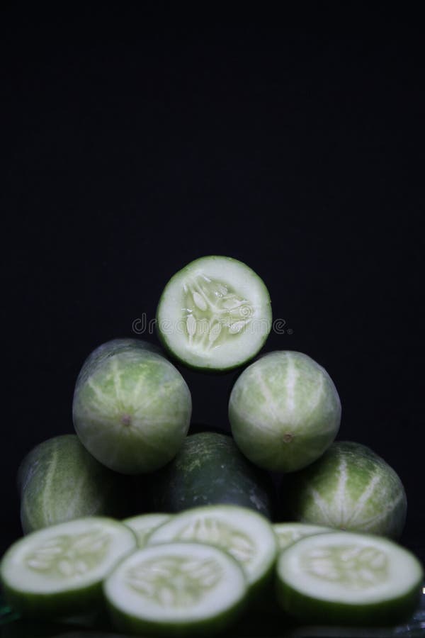 Cucumber Chunks Seven Potrait on a Background Black Stock Image - Image ...