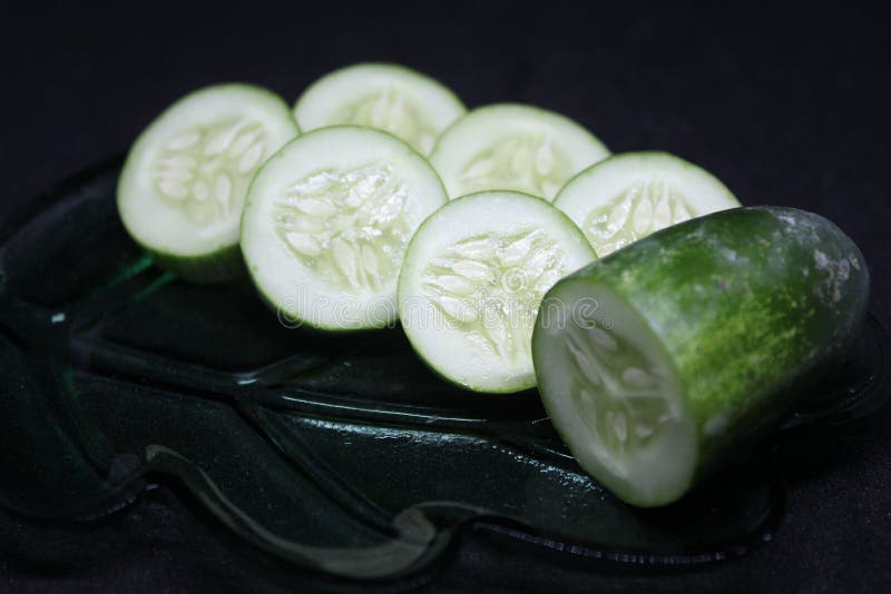Cucumber Chunks Seven Potrait On A Background Black Stock Image - Image ...