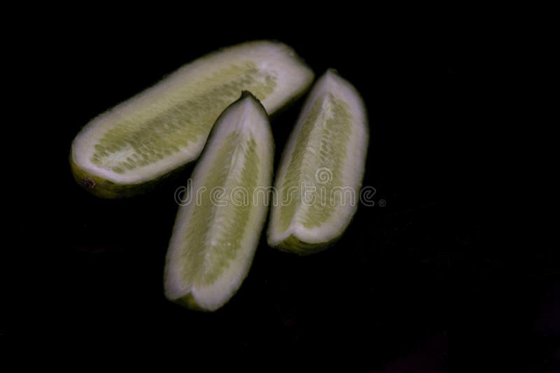 Cucumber Cut on a Dark Background with Interesting Highlights Stock ...