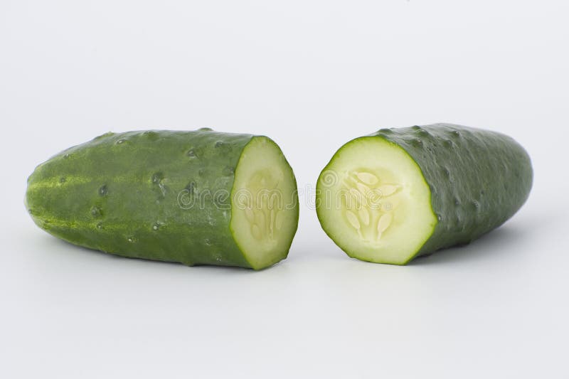 Cucumber cut in half. stock photo. Image of background - 51503596