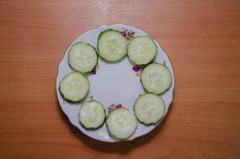 Cucumber on the plate stock photo. Image of kitchen - 184865128