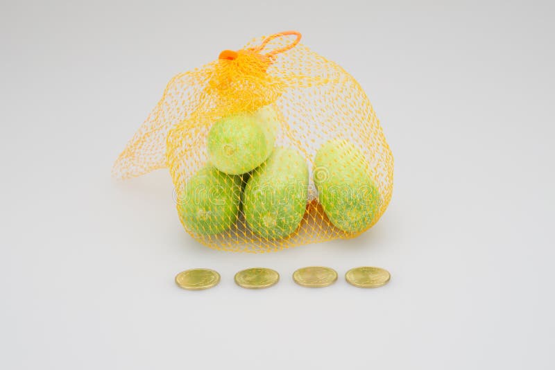 Cucumbers in Orange Mesh Resting Have Gold Coins As Foreground Stock ...