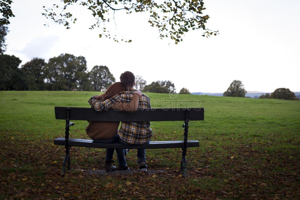 Cuddle in the Park stock photo. Image of grass, women - 73222138