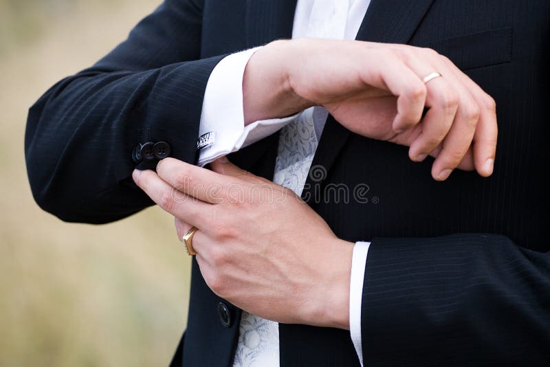 Man adjusting sleeve cuff stock photo. Image of husband - 2215544