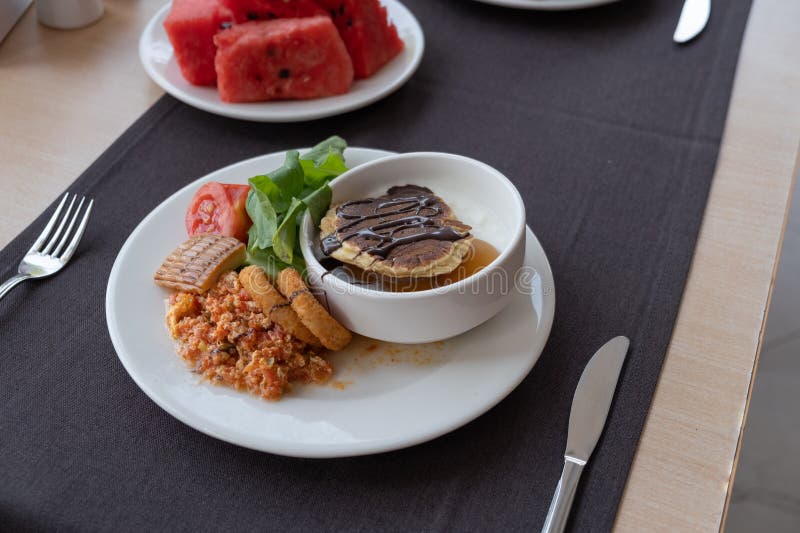 Culinary Delight Featuring Pancakes, Fresh Vegetables, and Assorted ...