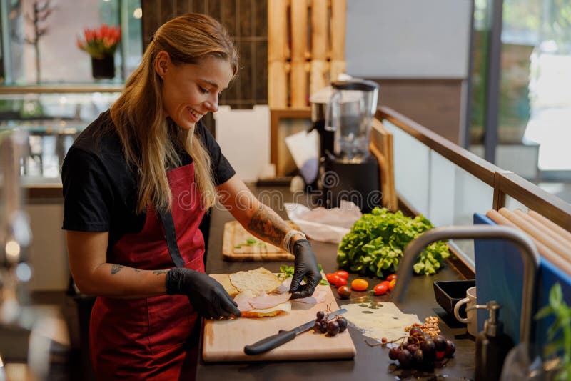A Culinary Expert Skillfully Preparing Fresh Ingredients in a Modern ...