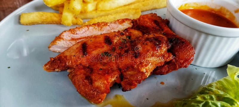 A Culinary Offering Featuring Chicken Steak As the Main Course at a ...