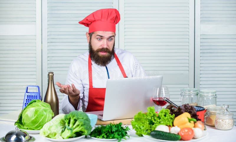 Culinary School. Hipster in Hat and Apron Learning How To Cook Online ...