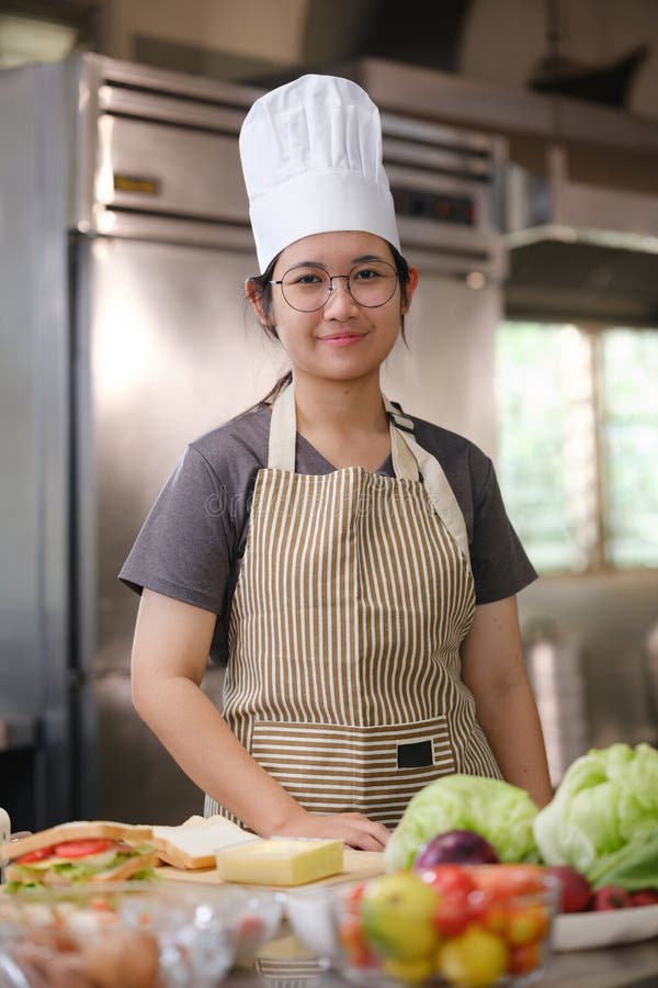 Culinary Student Standing Confidently in Training Kitchen with Fresh ...
