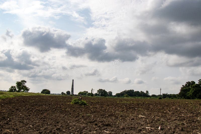 Cultivated Farm Land, Dramatic Sky, Brick Chimney Stock Image - Image ...