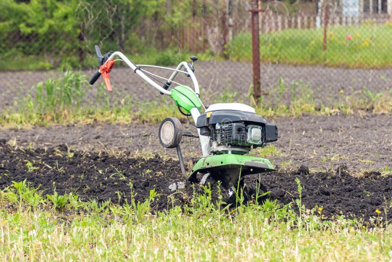 Cultivator for Cultivating the Soil in the Garden Stock Photo - Image ...