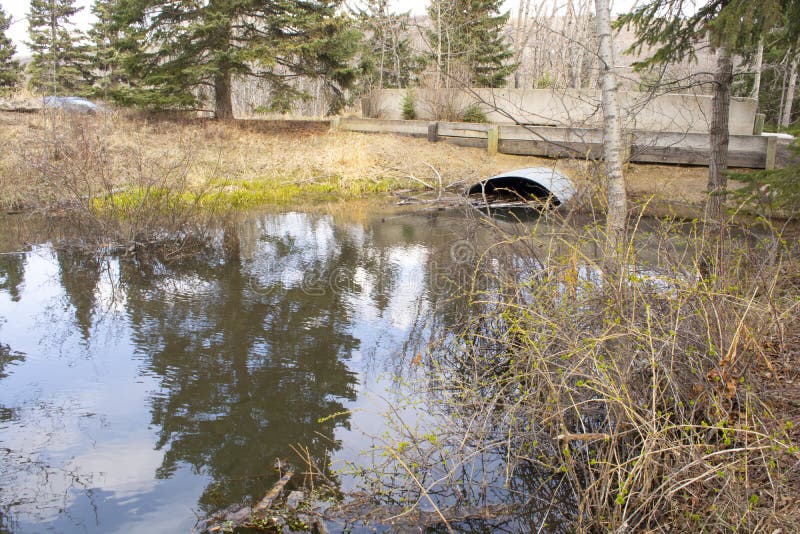Culvert Pipe Under Road from Stream Oxbow in Park Stock Image - Image ...