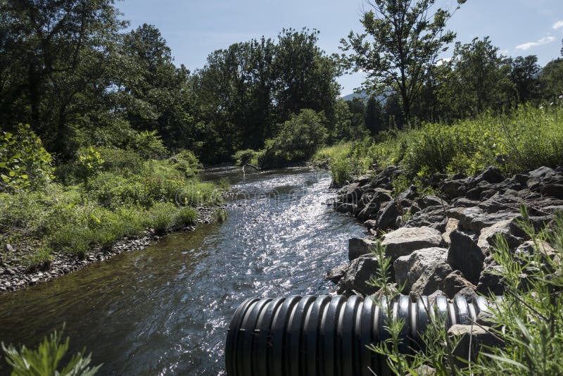 Culvert runoff to stream stock photo. Image of drainage - 119108794