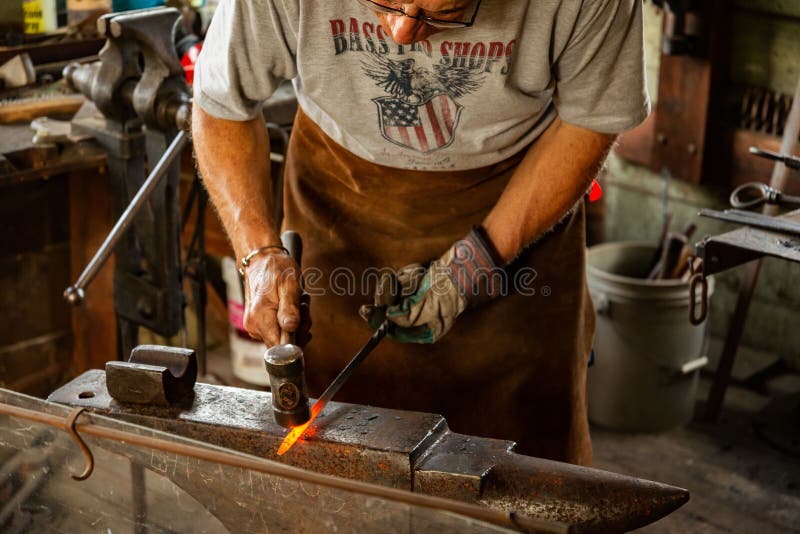 Blacksmith is Using Hammer To Forge Metal in a Workshop in Maine Editorial Photo - Image of ...