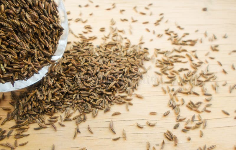 Cumin in a Glass Cup on a Wooden Table Stock Photo - Image of blue ...