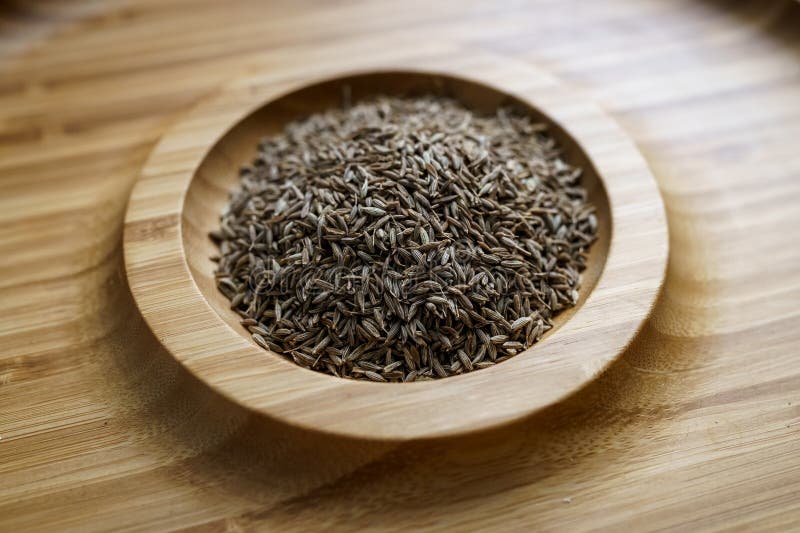 Cumin Seeds in a Wooden Plate Stock Illustration - Illustration of ...
