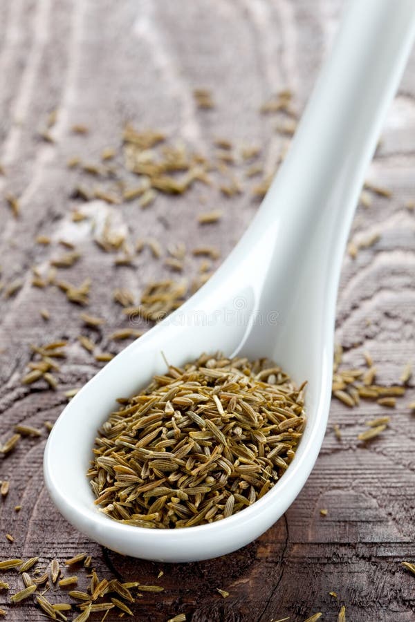 Cumin on spoon stock image. Image of ingredients, wooden - 17125947
