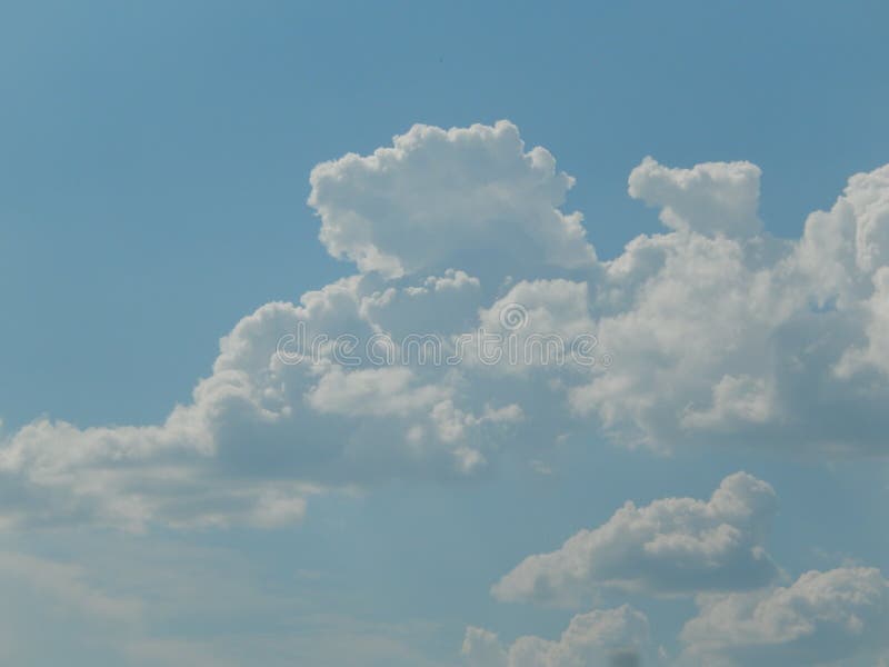 Cumulus Clouds on a Clear Blue Sky Stock Photo - Image of bright ...
