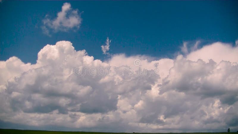 Cumulus Clouds Float Across a Clear Blue Sky. Storm and Rain Clouds at ...